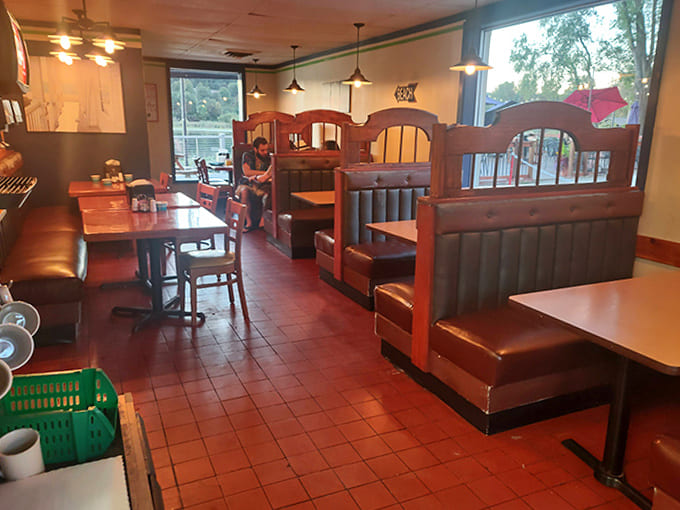 Cozy wooden booths create intimate dining nooks in this unpretentious eatery, where conversations flow as freely as the coffee refills.