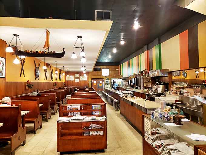 Wooden booths and counter seating create the perfect small-town caf&eacute; atmosphere where conversations flow as freely as the coffee.