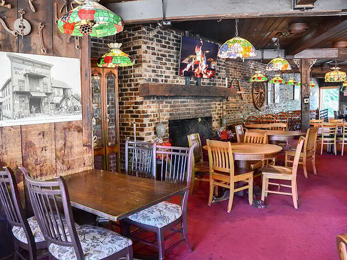 Exposed brick walls and wooden beams create a cozy atmosphere where vintage photographs tell stories of Long Grove's colorful past.