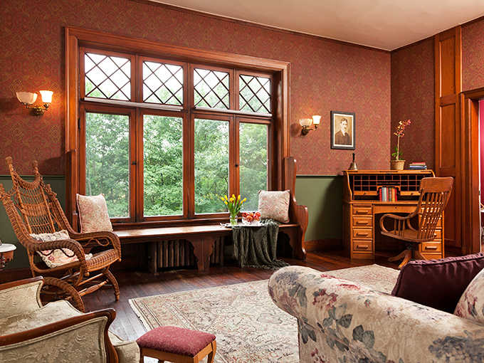 Sunlight streams through diamond-patterned windows, creating the perfect reading nook where time slows to the pace of a good book.