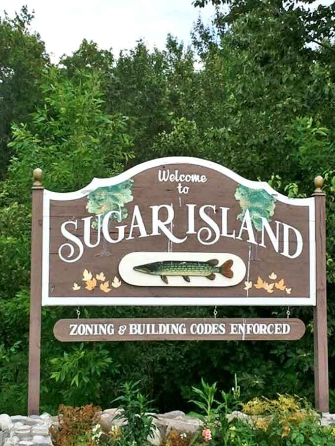 That "Zoning & Building Codes Enforced" sign is adorable, like the island is trying to be all official and serious while being utterly charming.