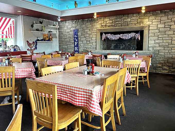 Red and white checkered tablecloths set the stage for comfort food memories, while stone walls whisper stories of decades past.