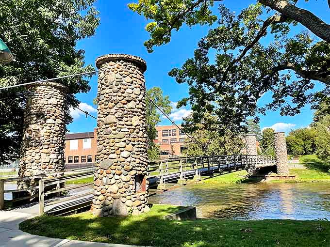 Wooden Bridge: This stone-pillared bridge isn't just crossing water &ndash; it's spanning centuries, connecting Owosso's past to its present with rustic elegance.