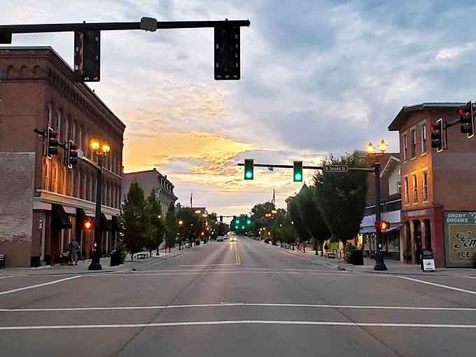 Sunset bathes Main Street in golden light, transforming an ordinary evening into something magical for evening strollers.