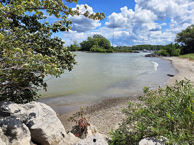 Nature's perfect curve &ndash; the gentle arc of shoreline creates a protected swimming area where families gather on hot summer days.