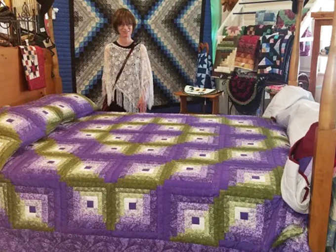 Vibrant quilts transform ordinary beds into showcases of Amish artistry, each stitch representing hours of patient, electricity-free craftsmanship.