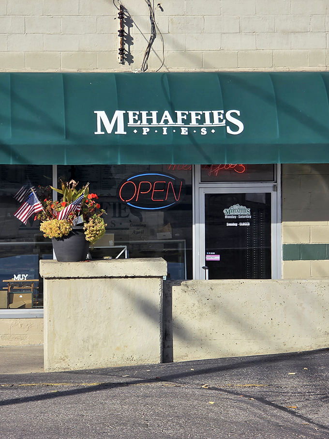 Morning light catches the "OPEN" sign like a beacon to pie pilgrims. The simple entrance belies the complexity of flavors waiting just beyond the threshold.