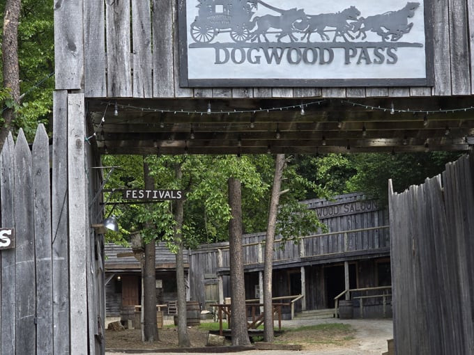 The iconic Dogwood Pass entrance sign welcomes visitors to this meticulously crafted slice of the Old West.