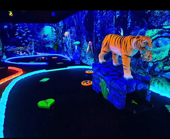 Step into a world where reality takes a vacation &ndash; neon pathways wind through a jungle that pulses with otherworldly blue and purple hues.