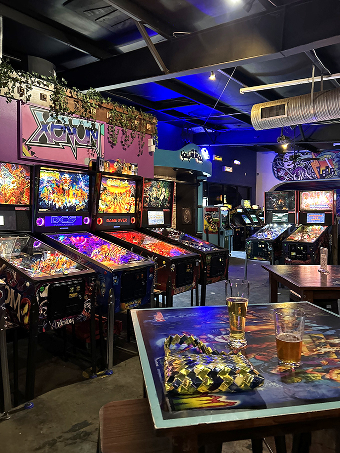 Inside Lowry Parcade, the glow of arcade cabinets creates a neon wonderland where nostalgia meets craft beer in perfect harmony.