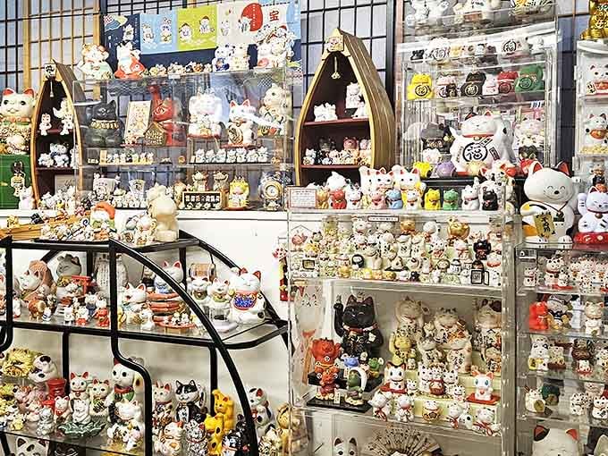 Wall-to-wall whiskers! The interior showcases an almost hypnotic array of Maneki-neko in every imaginable style, color, and material.