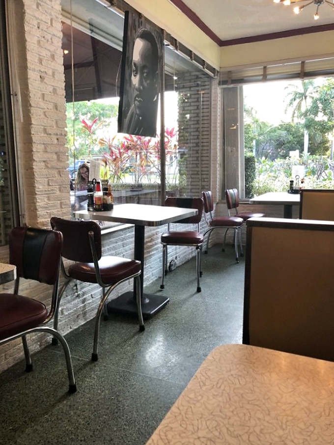 The classic diner interior features retro chrome accents, comfortable seating, and artistic touches that blend nostalgia with contemporary style.