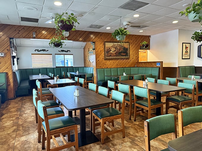 Wood paneling and green vinyl booths create that perfect time-capsule diner atmosphere where comfort trumps trendiness every single time.