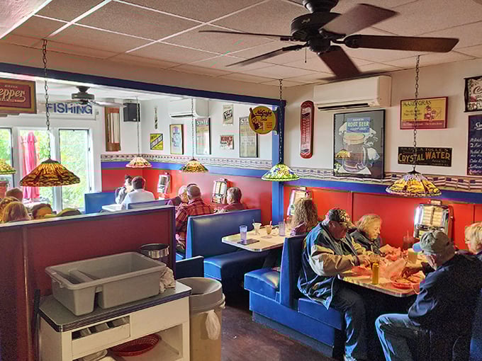 Step inside to a world where blue vinyl booths and Tiffany-style lamps create the perfect backdrop for burger-induced happiness.