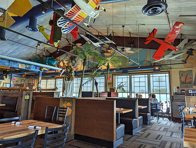 Look up! Model planes perform an eternal air show above diners, turning a simple meal into a journey through aviation history.