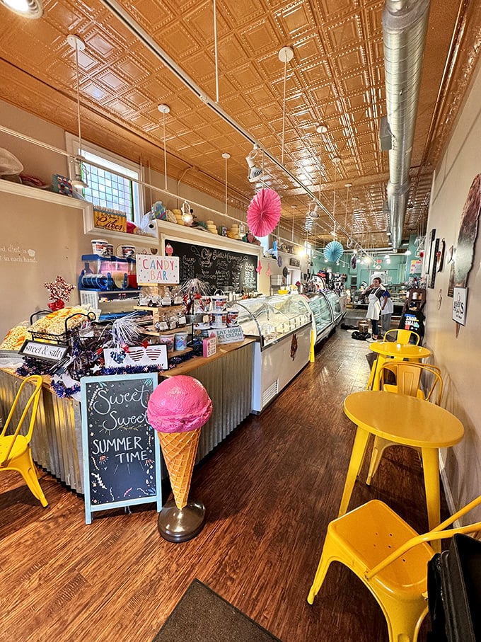 Copper ceiling tiles gleam above a wonderland of treats, while bright yellow chairs invite you to sit and contemplate just how many donuts constitute "too many."