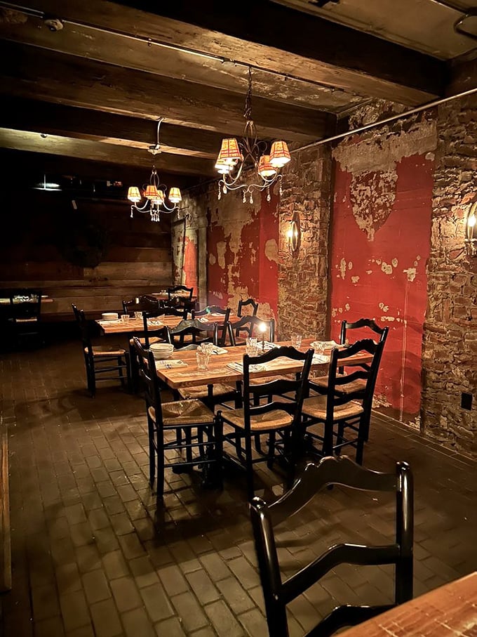 Step into a dining room where exposed brick, weathered walls, and warm lighting transport you straight to an Italian countryside taverna.