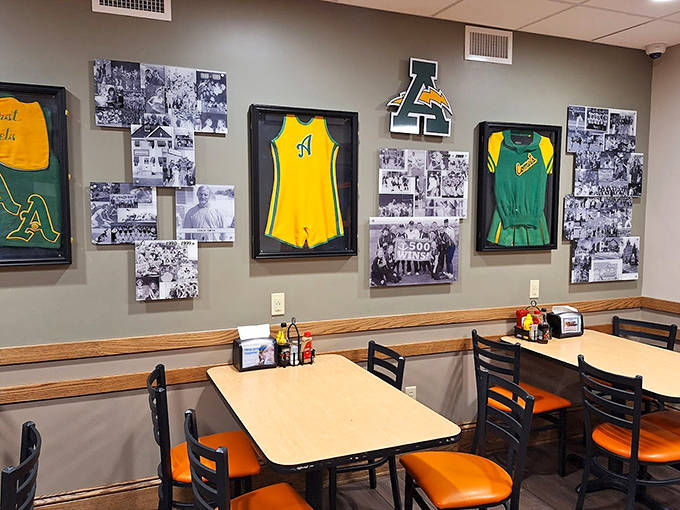 Sports memorabilia adorns the walls, celebrating local athletic achievements while creating a community atmosphere that feels like dining in a hometown hall of fame.
