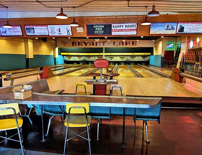 Vintage wooden lanes stretch invitingly before you, their warm patina telling stories of countless games and joyful gatherings.