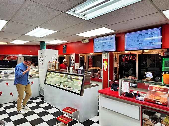 Step inside to a classic black-and-white checkered floor and red accents that transport you straight back to the golden age of ice cream parlors.