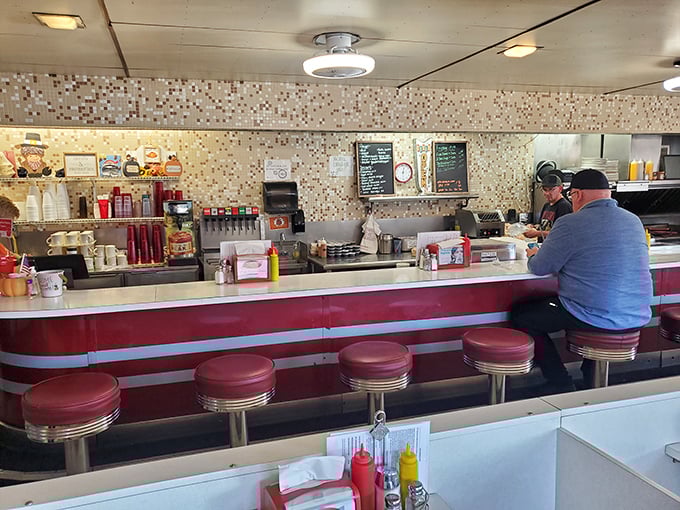 The classic diner counter at Ott's &ndash; where strangers become regulars and regulars become family over cups of bottomless coffee.