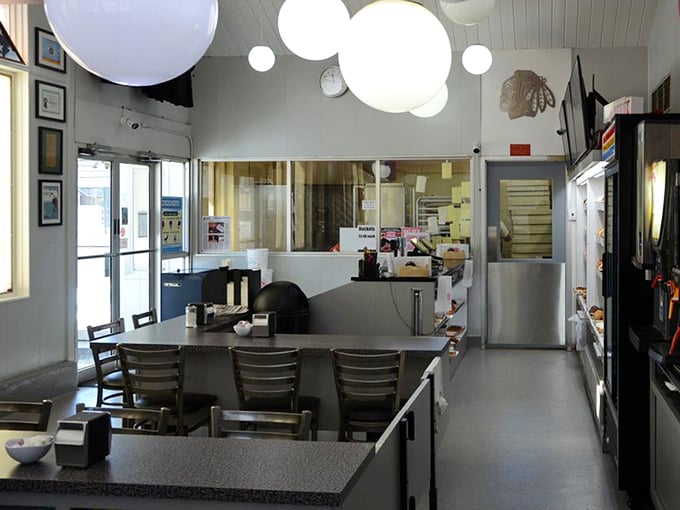 Interior: White globe lights hover like donut holes in the sky above this no-nonsense interior where serious donut business happens daily.