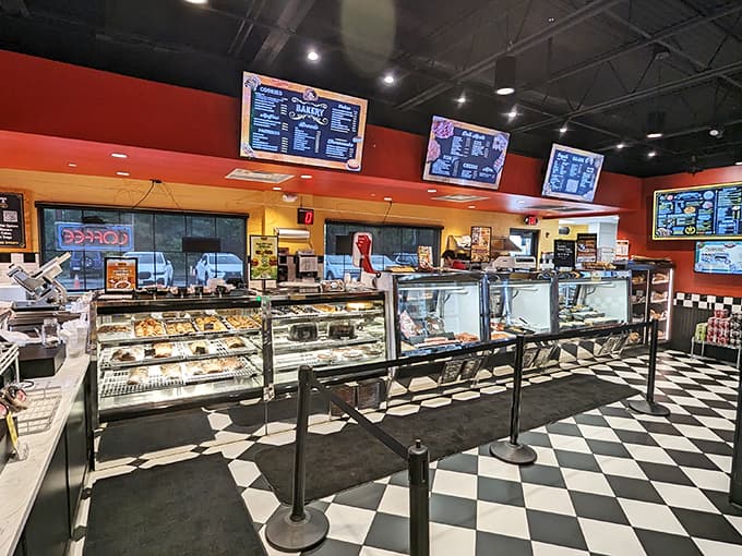 Modern pendant lights dangle like artistic installations above comfortable seating, creating an atmosphere where conversation flows as easily as the wine.