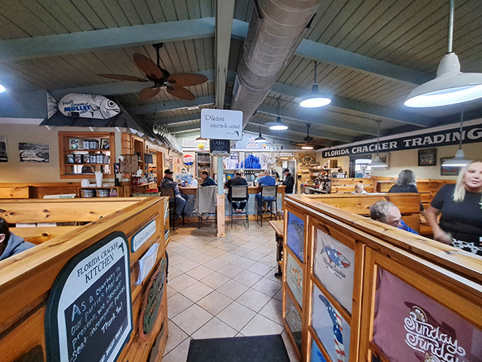 Step inside to discover wooden booths, rustic charm, and a bustling atmosphere where locals and visitors gather to experience authentic Florida cuisine.