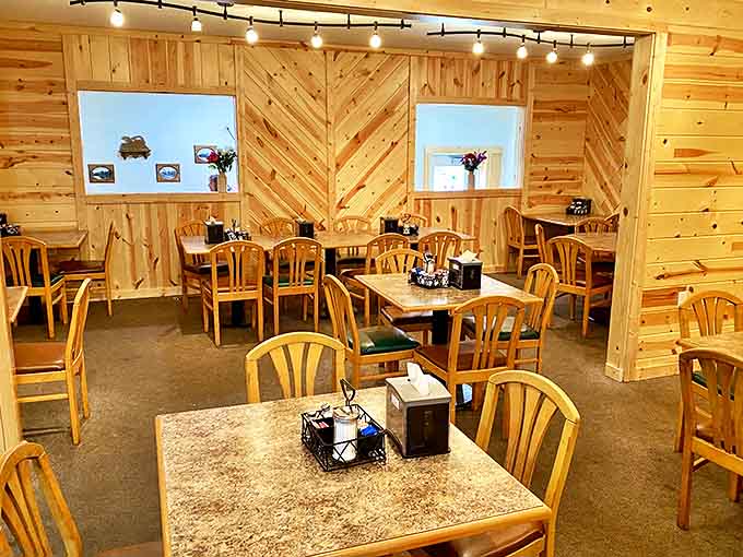 Knotty pine walls create the perfect backdrop for breakfast magic &ndash; like dining inside a cozy cabin where calories don't count and conversation flows freely.