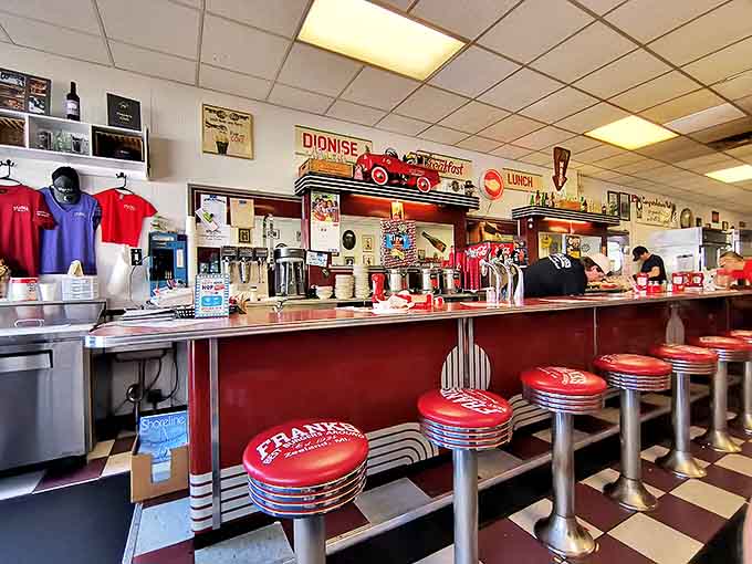 Interior: Classic checkered floors and cherry-red counter stools transport diners to a simpler time when calories were just numbers.