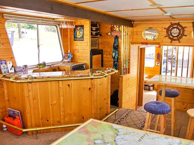 Warm wooden interiors with nautical touches transform this floating tiki bar into a cozy island getaway, no passport required.
