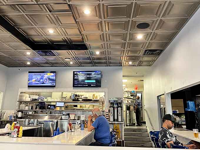 Classic diner vibes with a modern twist &ndash; the counter seating offers front-row views to the culinary magic happening in the kitchen.