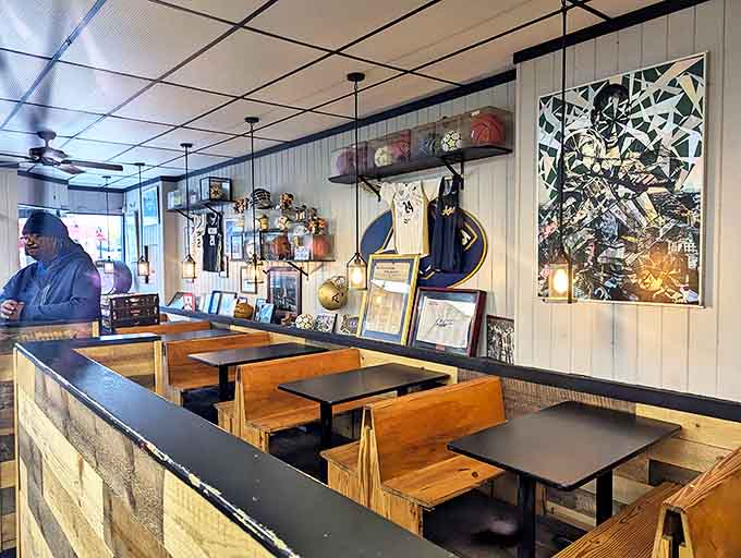 Interior: Wooden booths and sports memorabilia create the perfect backdrop for sandwich worship at this beloved Akron institution.