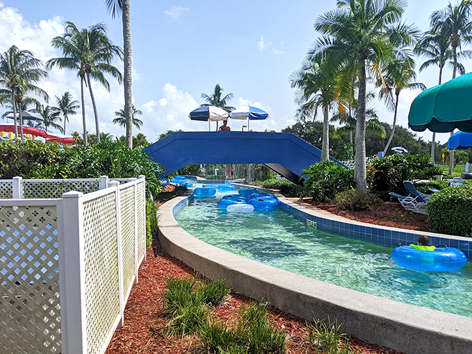 The lazy river winds through lush landscaping, offering a gentle current perfect for floating away your worries&mdash;no paddling required!