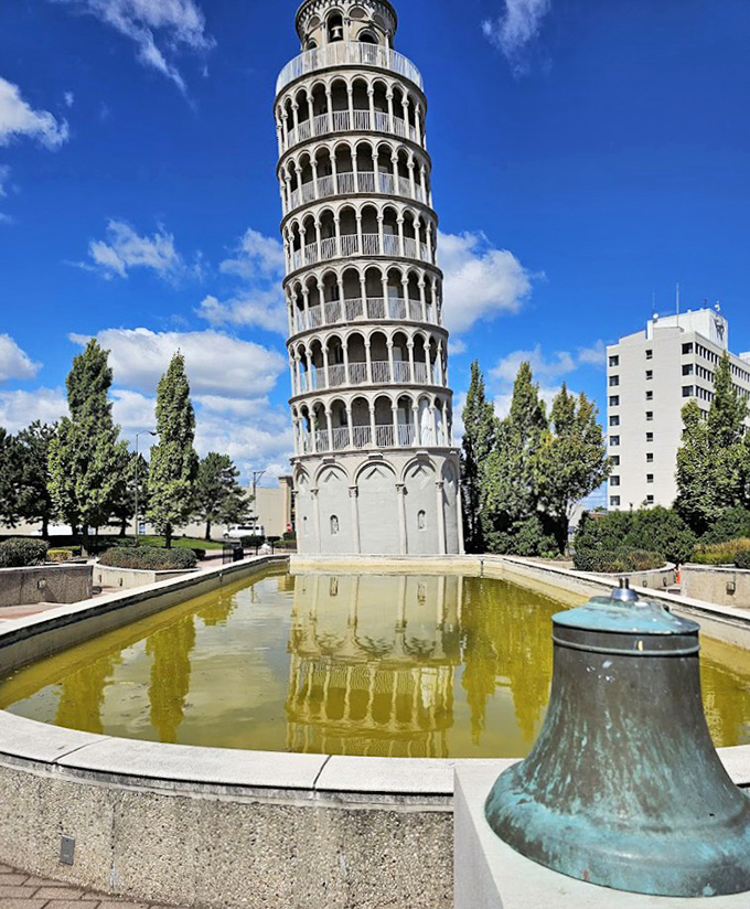 Reflecting in its surrounding pool, the tower creates a perfect mirror image that doubles the visual impact of this Midwestern architectural oddity.