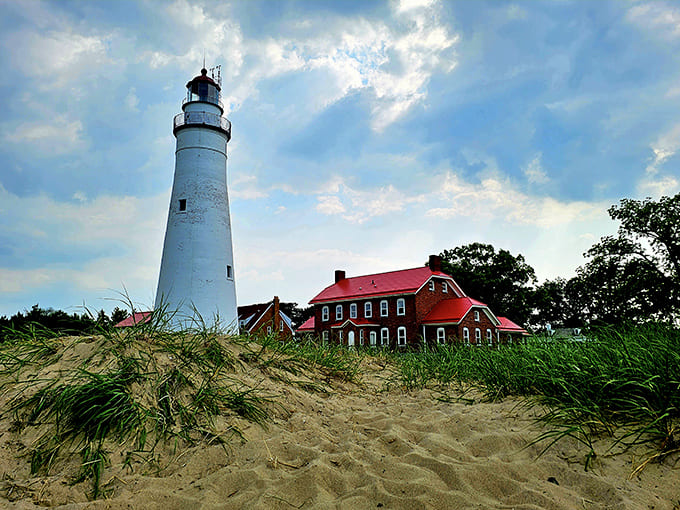 Fort Gratiot Lighthouse has been standing guard since 1825, making it older than your great-great-grandparents and significantly better at staying upright through Michigan winters.