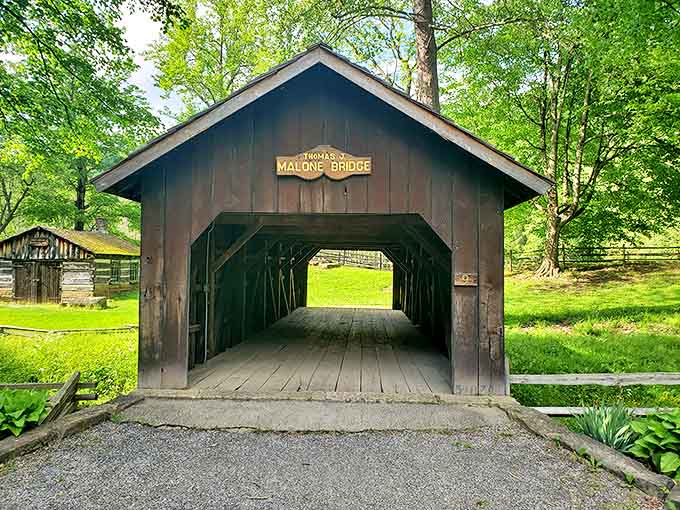 The Thomas Malone covered bridge stands as a wooden time capsule, its weathered planks telling stories of horse-drawn carriages and simpler times.