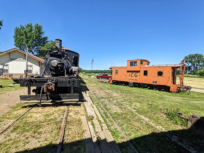 This steam locomotive and caboose combo looks like it rolled straight out of a time when trains had personality and every journey felt like an adventure worth taking.