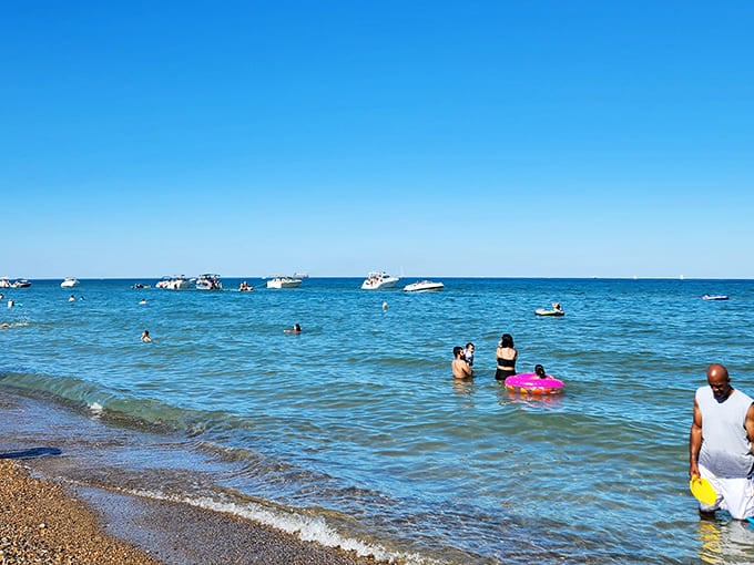 Nothing says summer quite like families claiming their sandy territories, armed with umbrellas, coolers, and enough sunscreen to protect a small army.