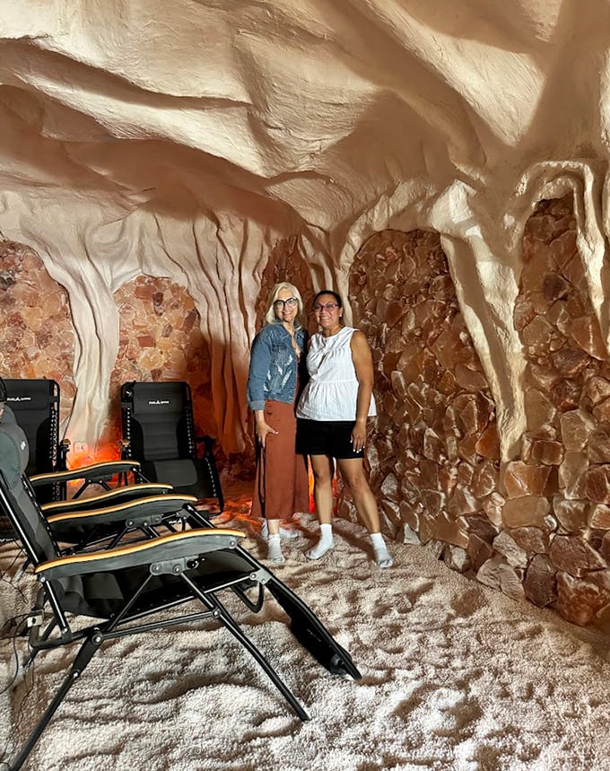 Salt cave interior with recliners: Zero-gravity chairs invite weary souls to float away in a sea of pink crystalline calm. Relaxation has never looked so rosy.