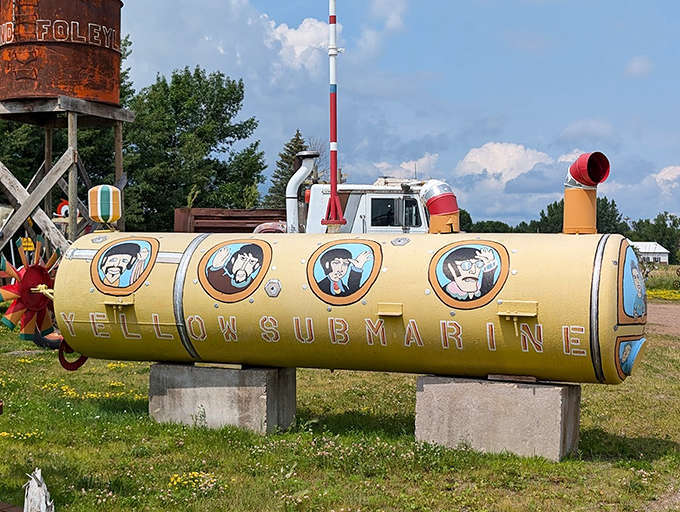 The Yellow Submarine sits landlocked in Minnesota, proving the Beatles' influence extends even to Midwestern farm equipment repurposing. Those porthole faces look suspiciously familiar!