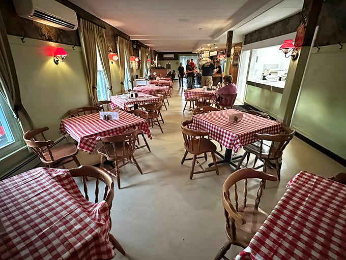 Step inside and time slows down &ndash; red checkered tablecloths and warm lighting create the perfect stage for pizza magic.