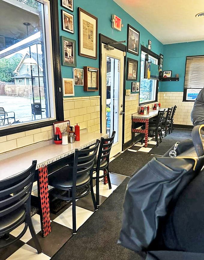 Turquoise walls and vintage photographs create the perfect backdrop for morning conversations and coffee refills.