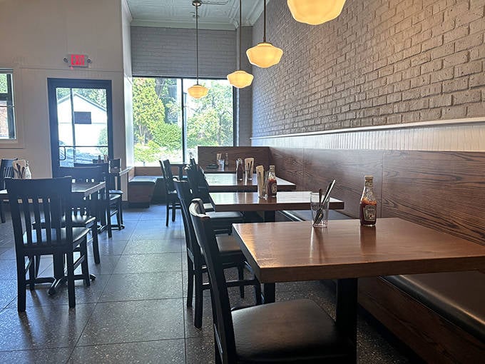 Behind this glass fortress of temptation lies a treasure trove of handcrafted donuts, each one beckoning with sugary promises.