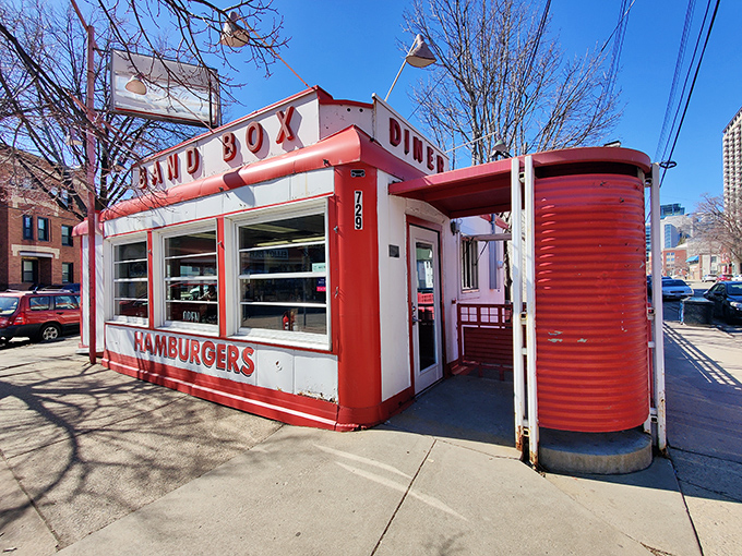 The compact red and white Band Box Diner stands proudly in Minneapolis, its bold "HAMBURGERS" sign promising simple pleasures inside.
