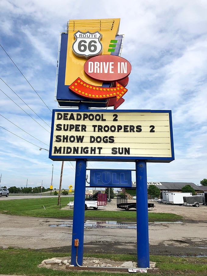 Route 66 Drive-In's vibrant sign showcases current blockbusters while inviting moviegoers to visit their snack bar &ndash; a perfect pairing of nostalgia and modern entertainment.