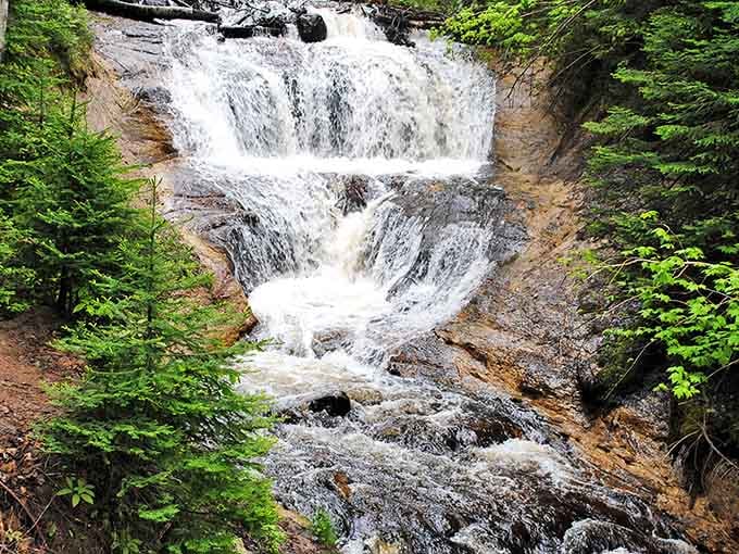 Sable Falls tumbles down like nature's own wedding veil, delicate yet powerful against the forest backdrop.