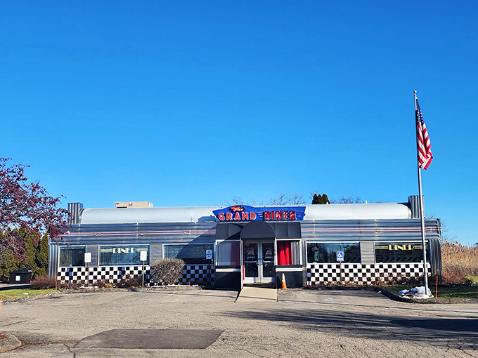 The Grand Diner's polished silver exterior and classic neon signage transport you back to simpler times before you even step inside.
