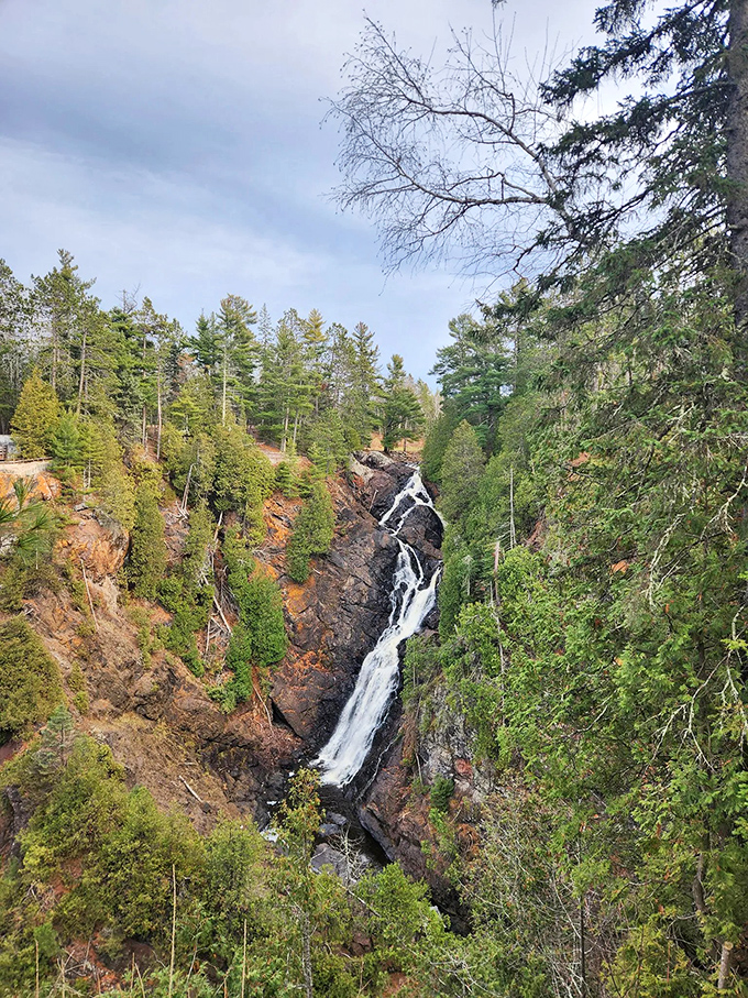 The majestic 165-foot drop of Big Manitou Falls rivals scenes from national parks, yet remains a hidden gem in Wisconsin's northern forests.
