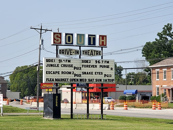 South Drive-In's classic roadside marquee advertises current films and their popular flea market. Those vintage letters spelling out movie titles never get old!